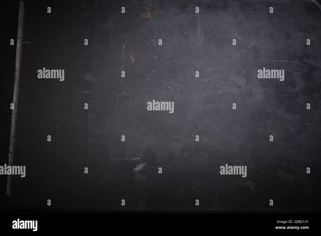 Baking tray or oven pan dark grey texture with small scratches top view ...