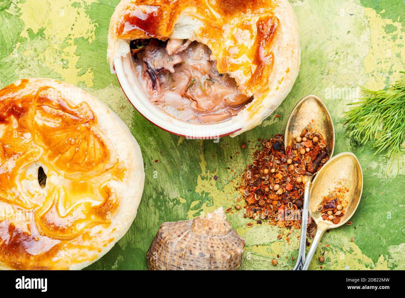 Baked seafood with bread cap.Squid and mussel julienne.Cream seafood ...