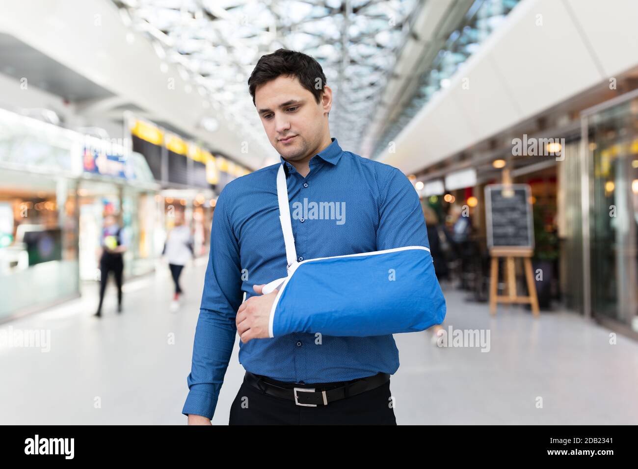 Man With Broken Arm In Airport Terminal Stock Photo - Alamy