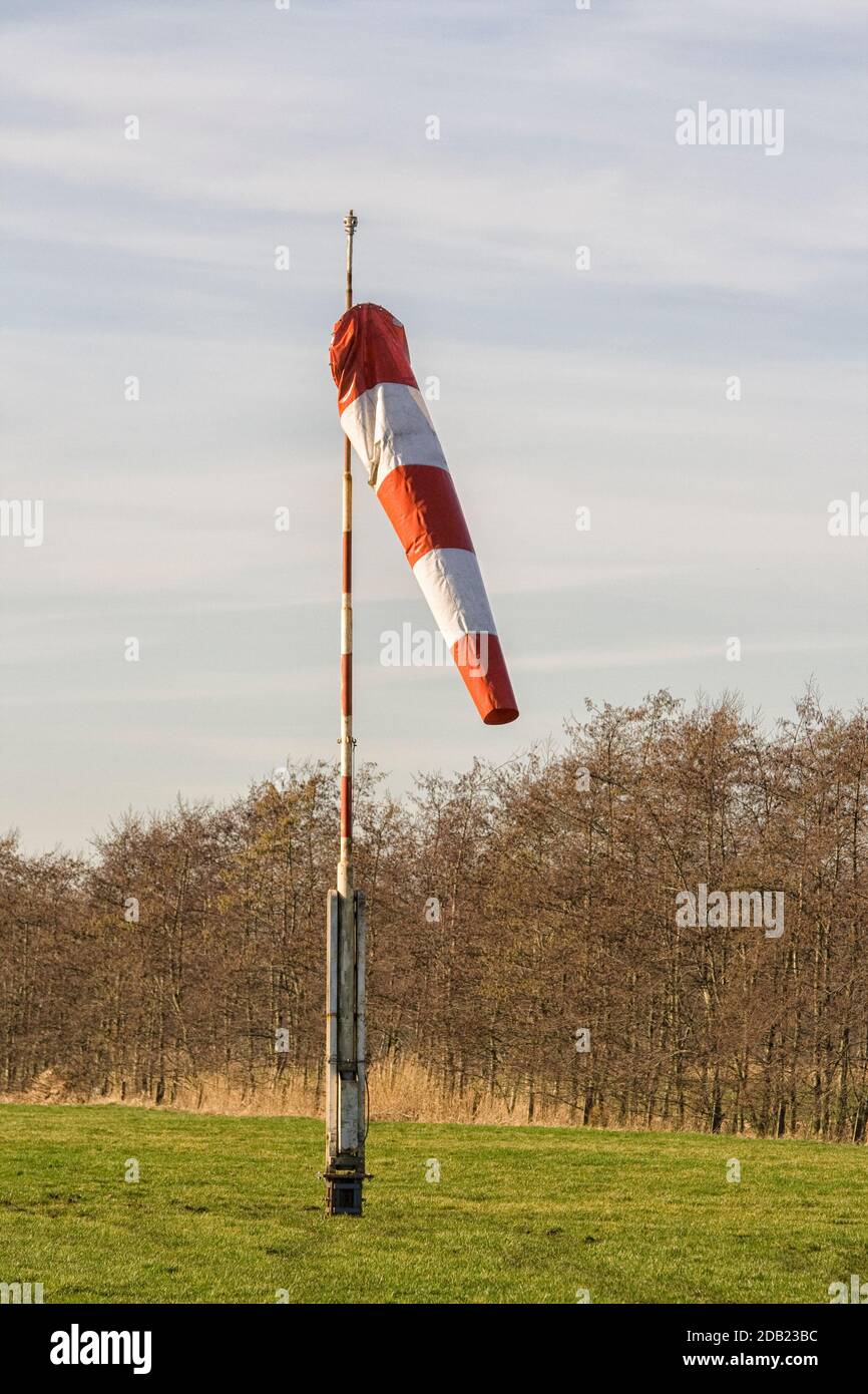 Windsock standing in green grass Stock Photo - Alamy