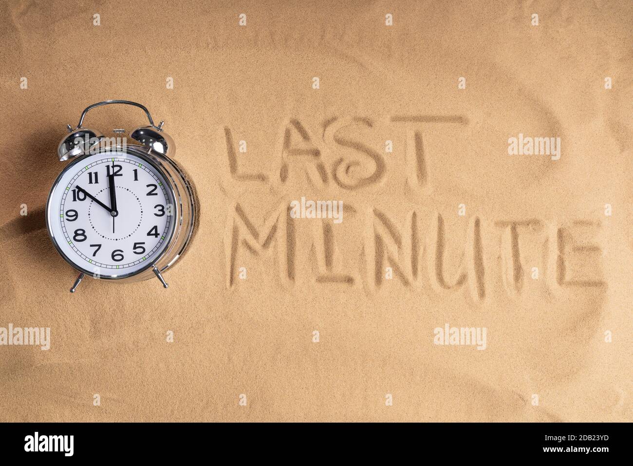Last Minute Alarm Clock In Sand On Tropical Beach Stock Photo - Alamy