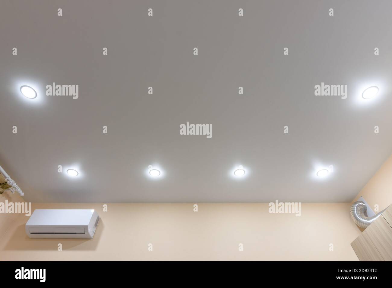 On the stretch ceiling are located on the preimeter point light bulbs ...