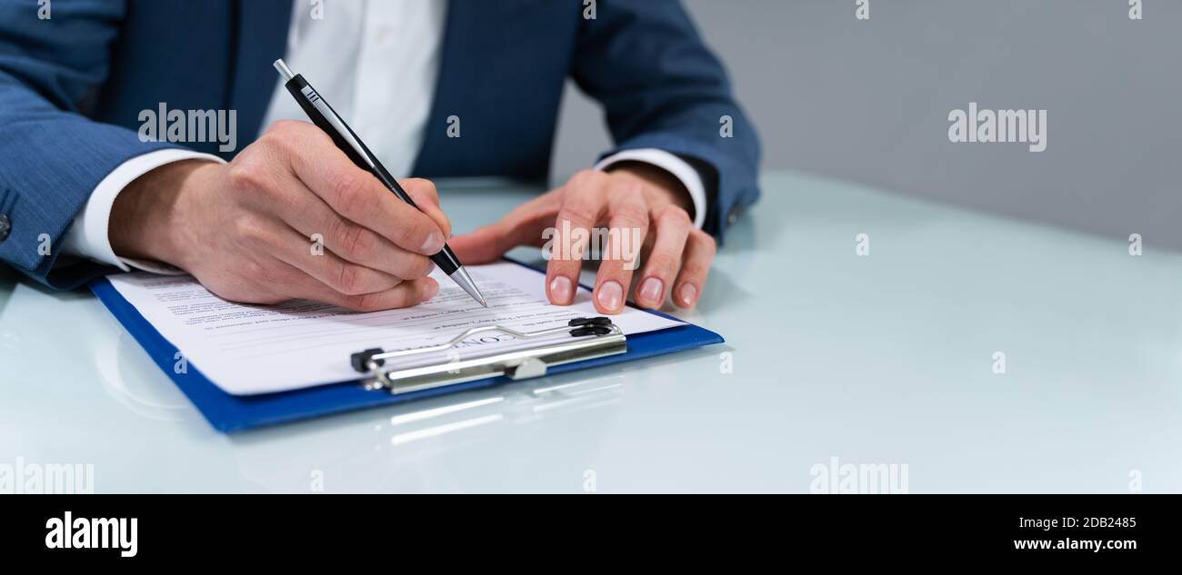 Close-up Of A Person's Hand Signing Contract Stock Photo - Alamy