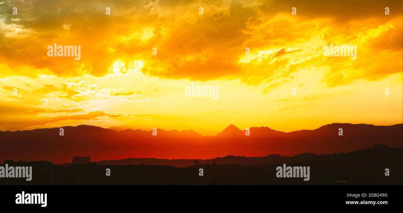 Spain, Andalusia. Amazing Sunset Sunrise With Sun Over Dark Mountain ...