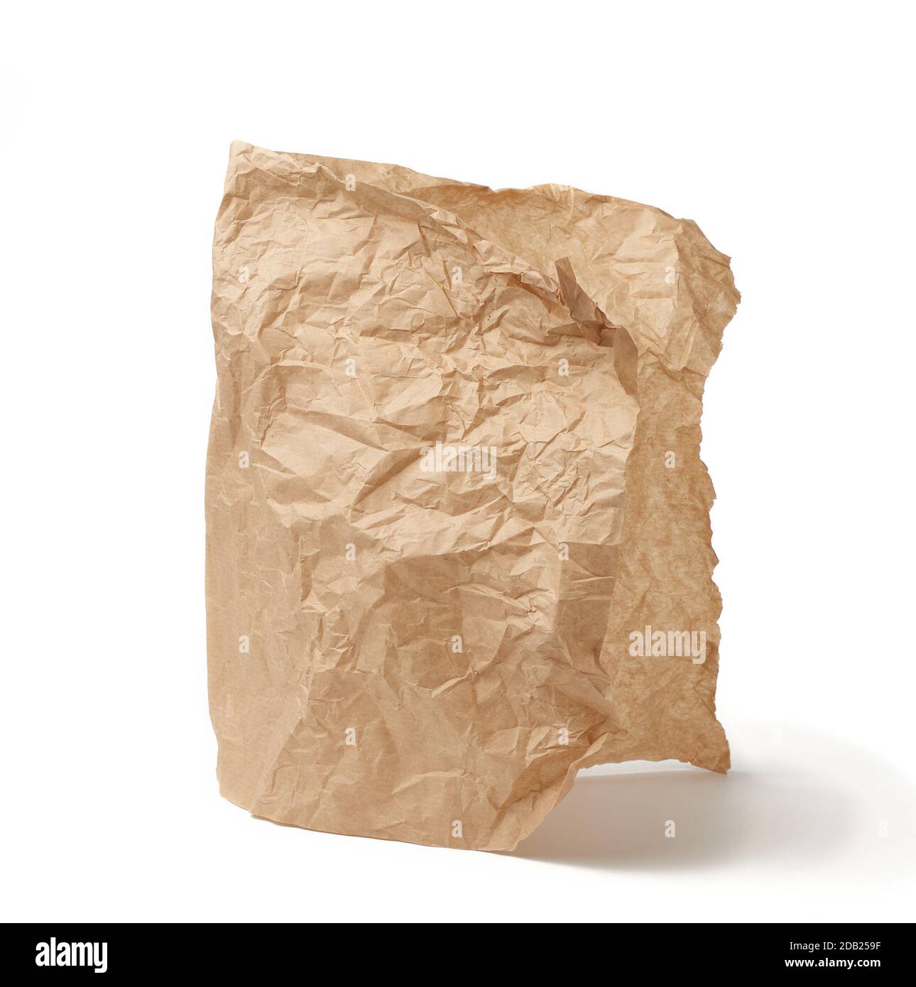 folded brown crumpled sheet of parchment paper isolated on white ...