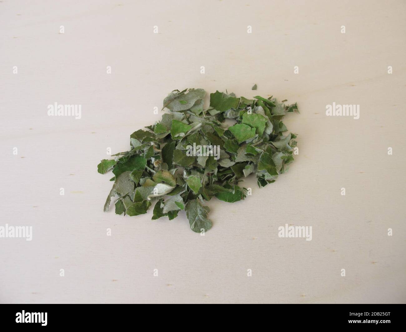 Dried quince leaves for quince leaf tea on a wooden board Stock Photo ...