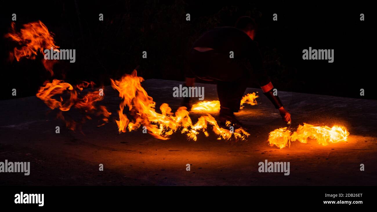 Fire solo performer perform night show with huge burning flames in ...