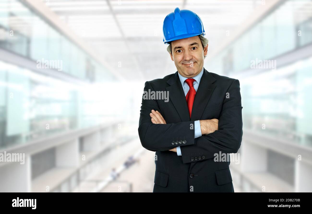An engineer with blue hat at the office Stock Photo - Alamy