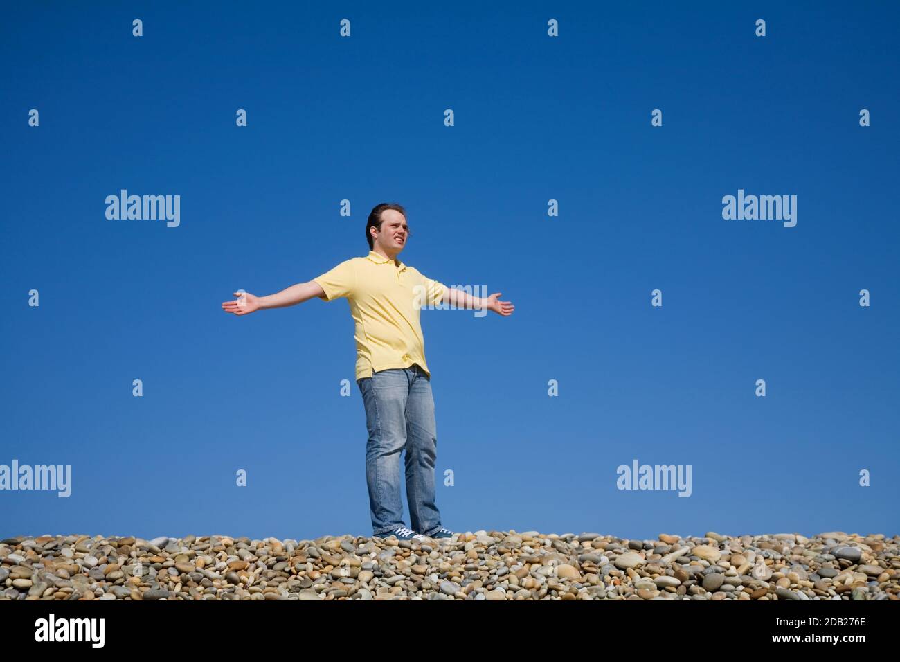man with arms wide open at the beach Stock Photo - Alamy