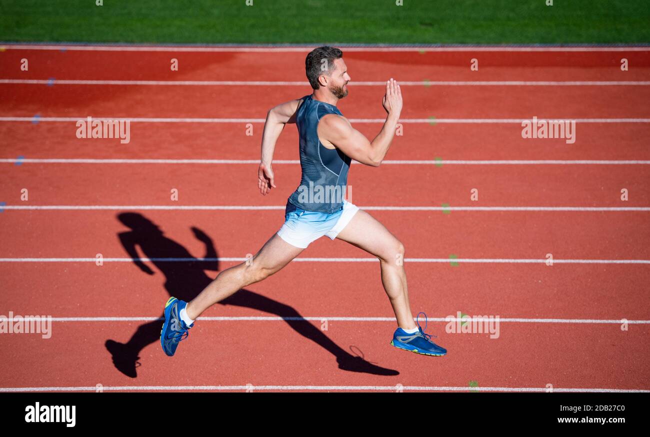 male sprinter running from start to finish with success and speed, race ...
