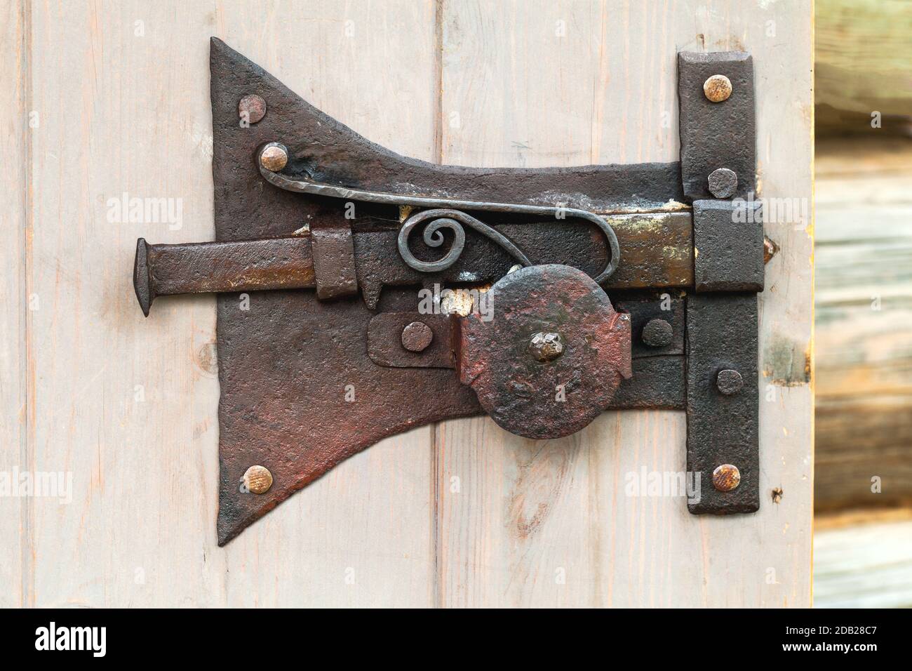 Vintage iron lock of an old wooden door, close up photo Stock Photo - Alamy