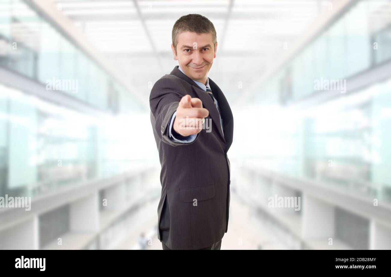happy business man pointing, at the office Stock Photo - Alamy