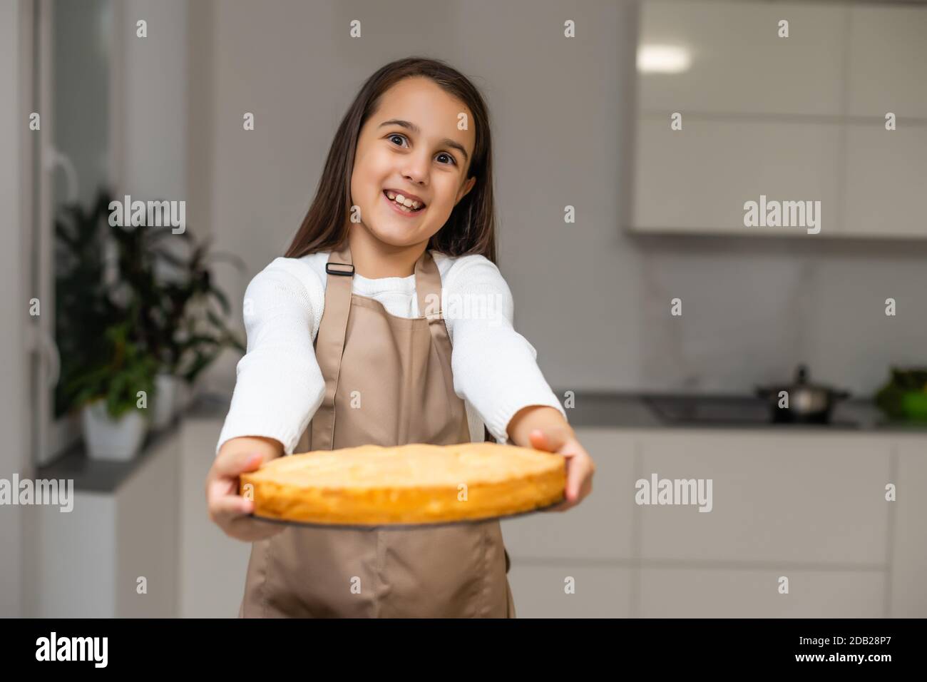 little girl showing apple pie that she baked Stock Photo - Alamy
