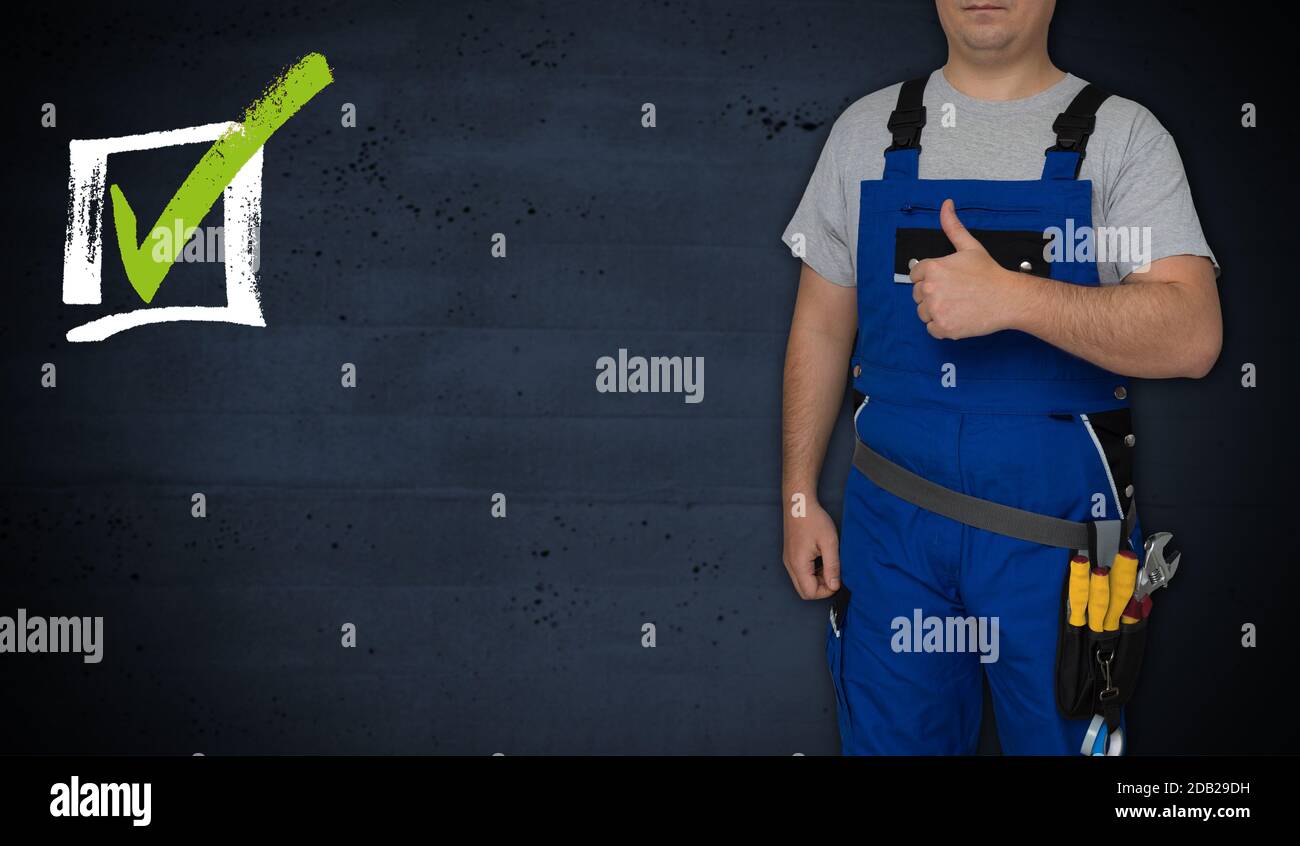 Checkbox and craftsman with thumbs up Stock Photo - Alamy
