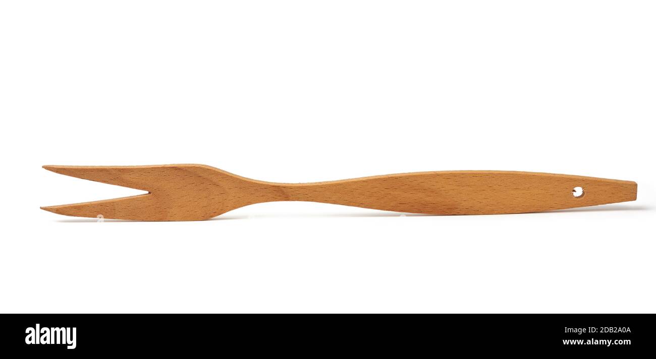 wooden yellow fork isolated on white background, vintage appliance ...