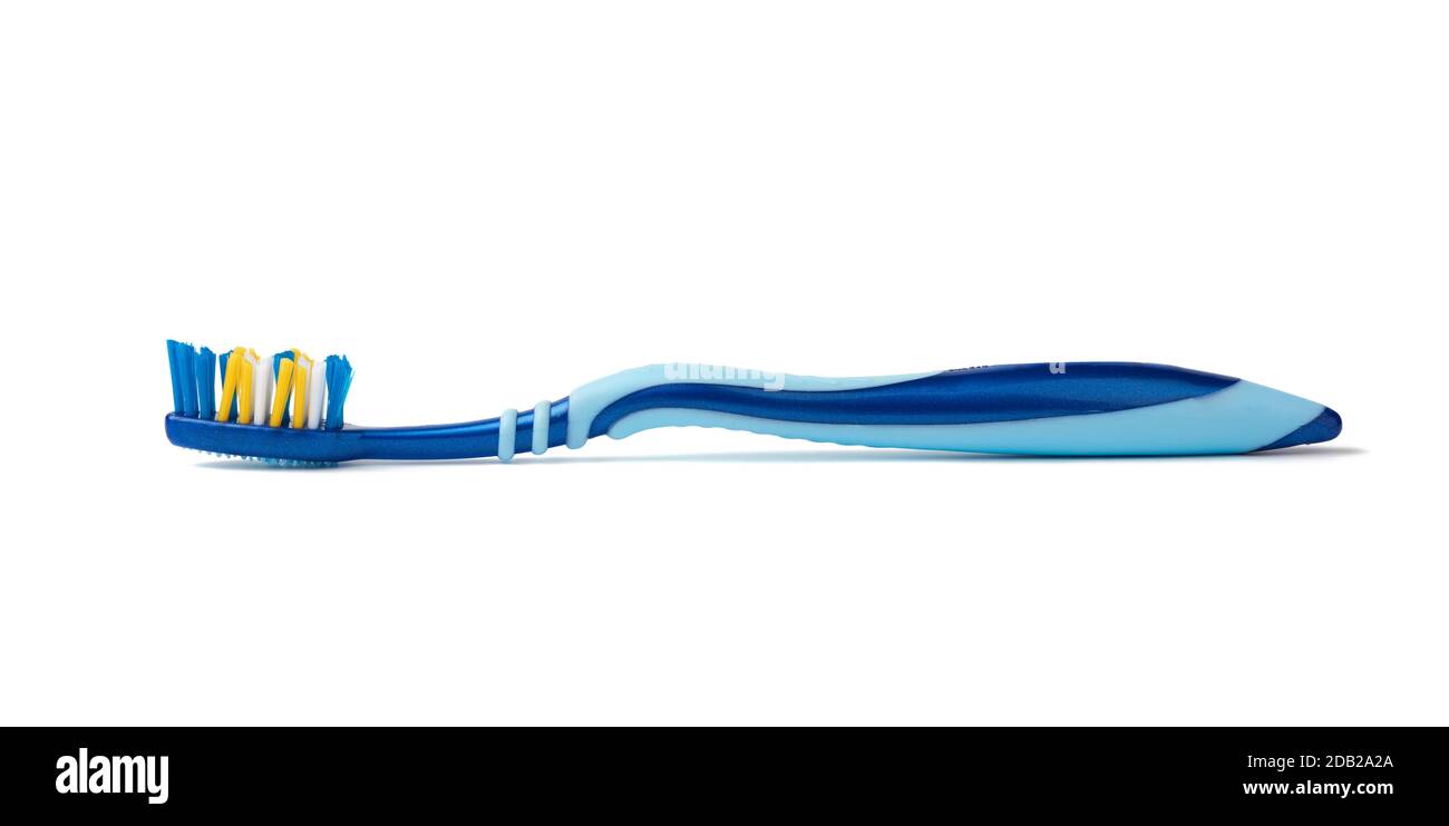 blue plastic toothbrush for cleaning the oral cavity, object is ...