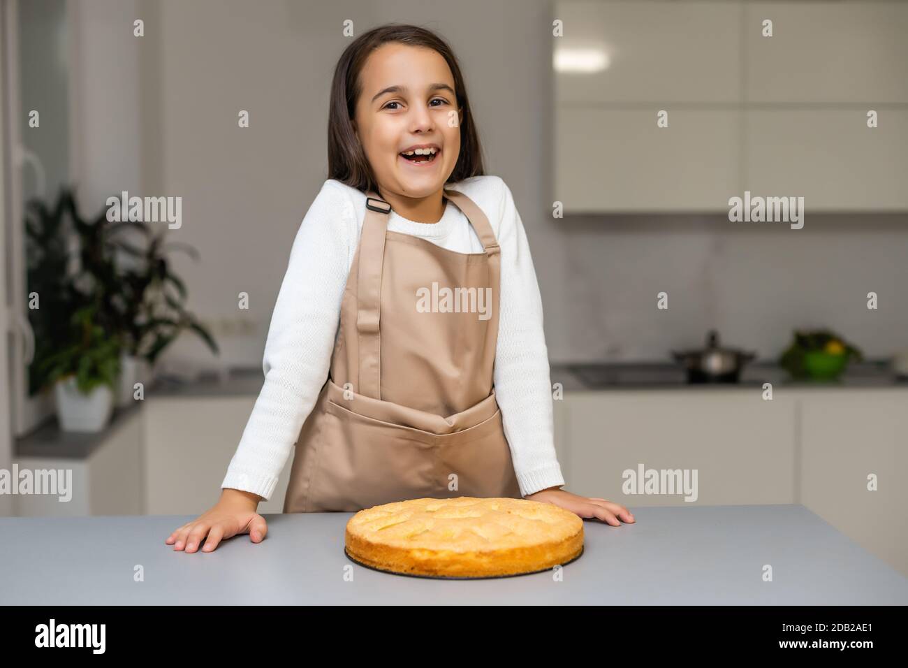 little girl showing apple pie that she baked Stock Photo - Alamy