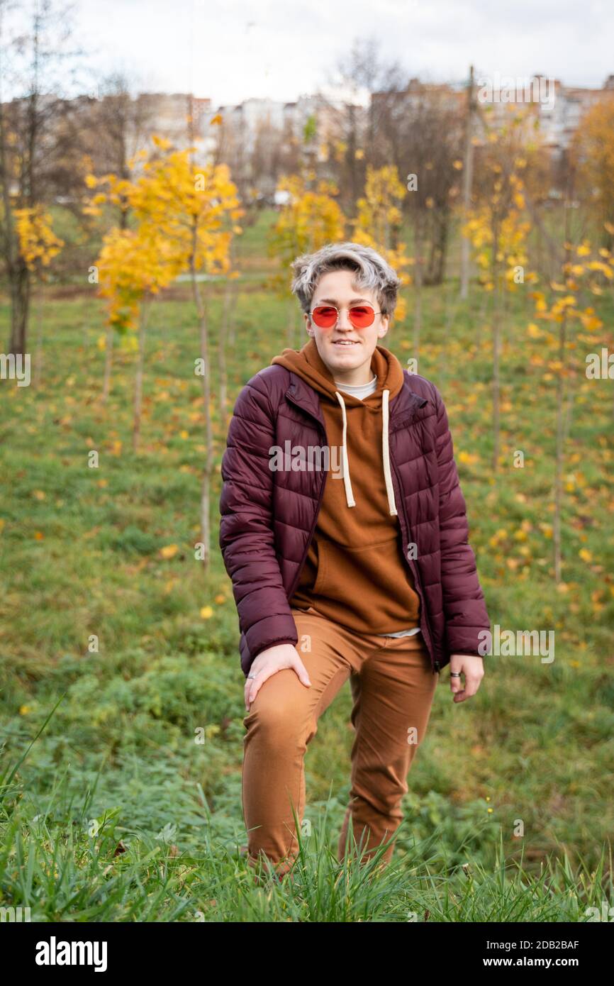 New femininity - gender neutral style. Young woman with stylish short ...