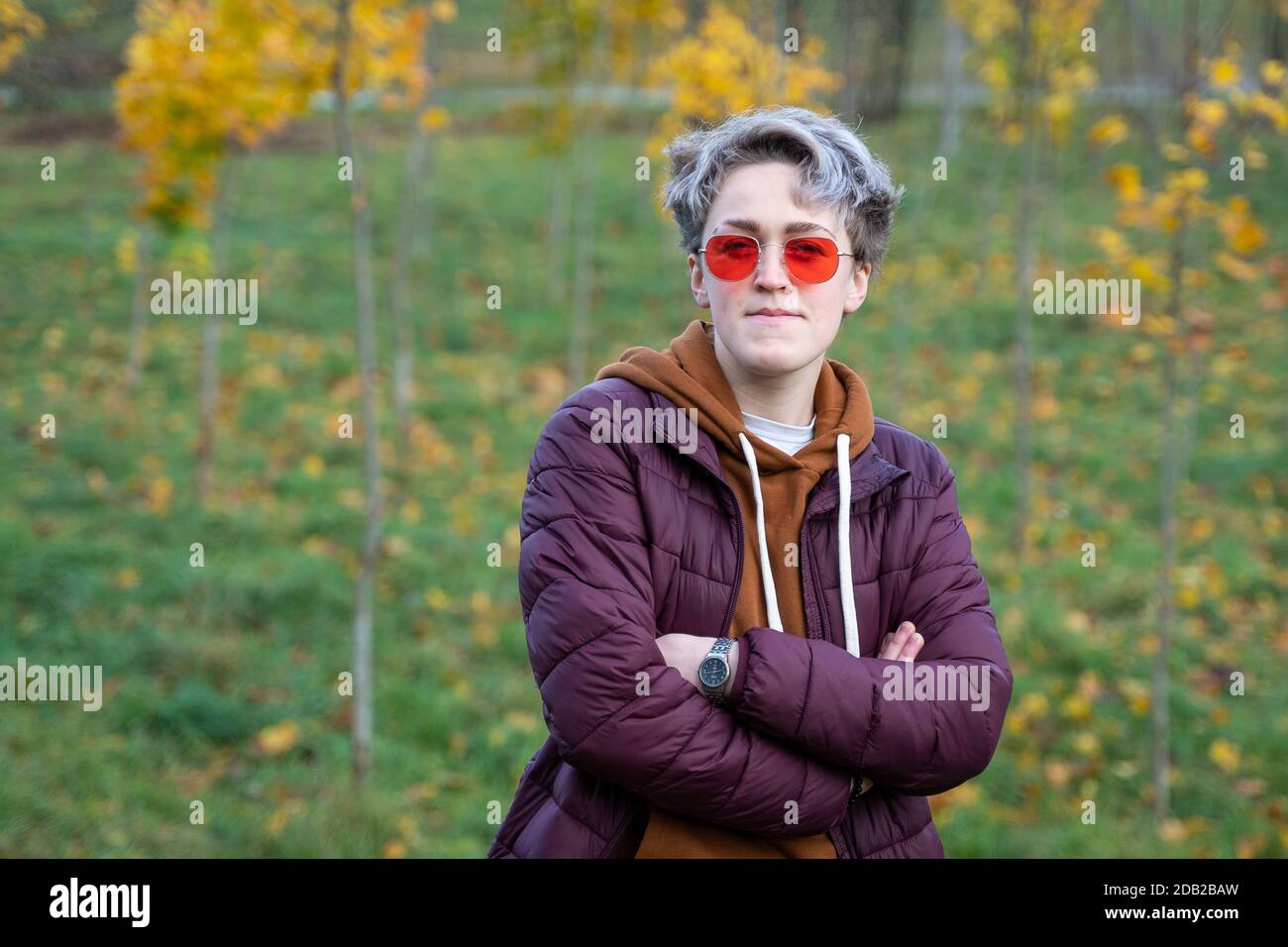 New femininity - gender neutral style. Young woman with stylish short ...