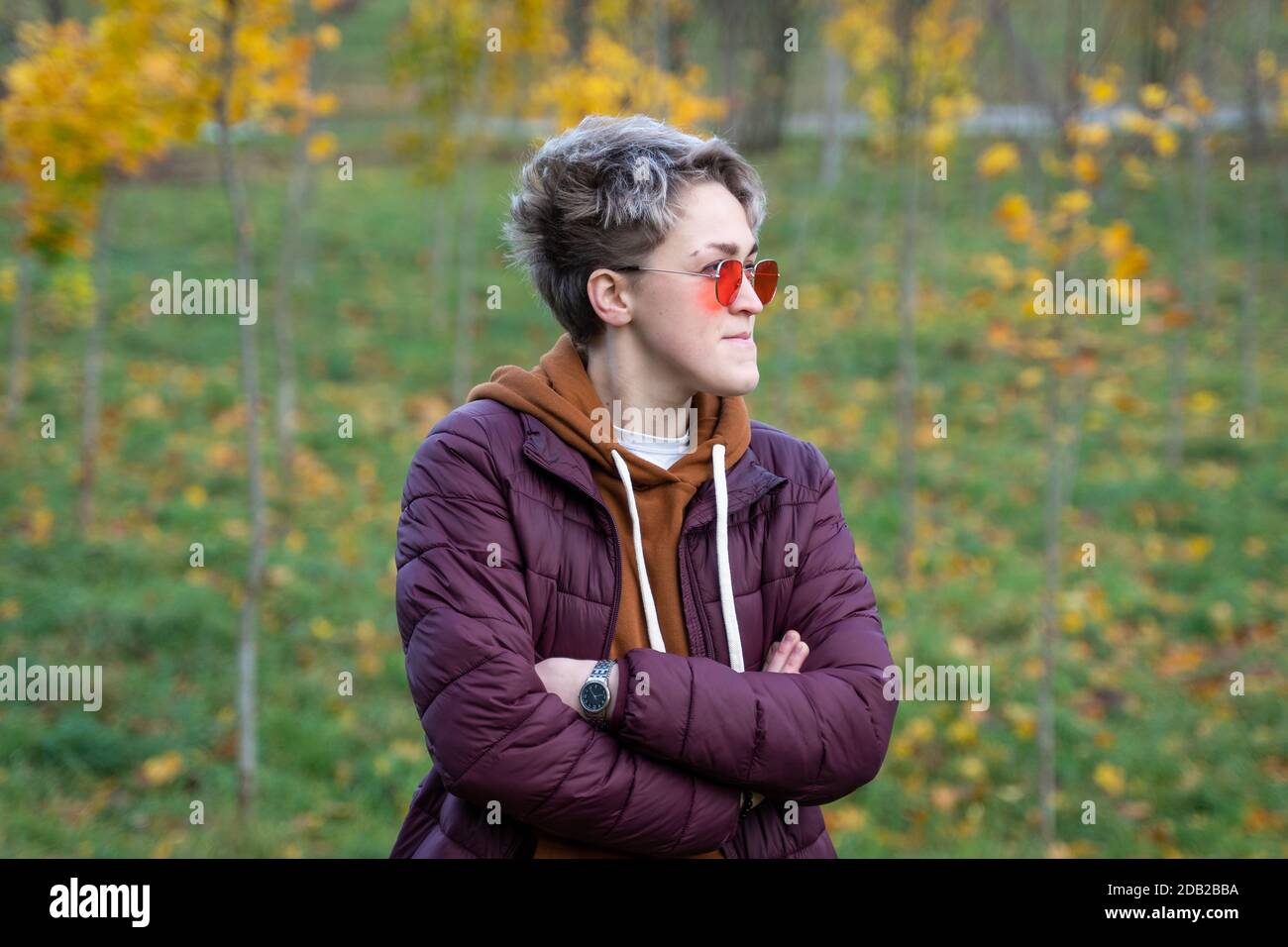 New femininity - gender neutral style. Young woman with stylish short ...