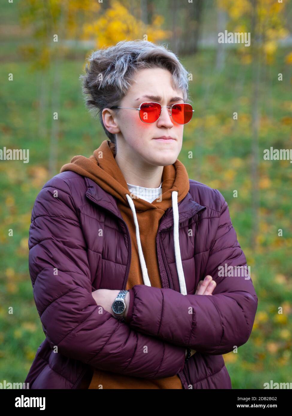 New femininity - gender neutral style. Young woman with stylish short ...