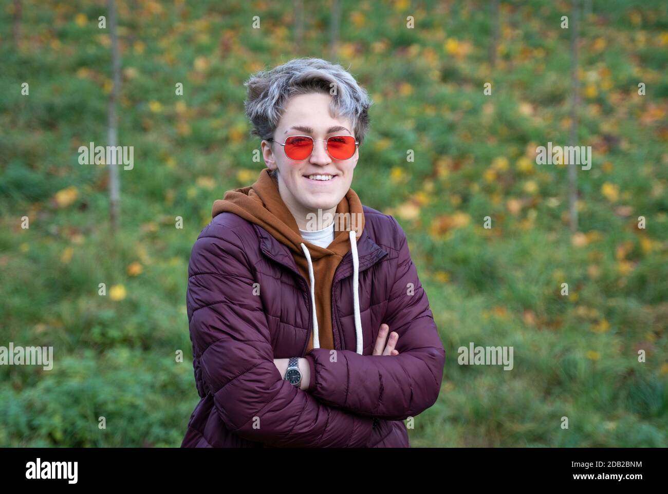 New femininity - gender neutral style. Young woman with stylish short ...