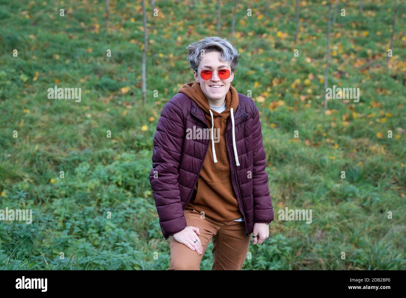 New femininity - gender neutral style. Young woman with stylish short ...