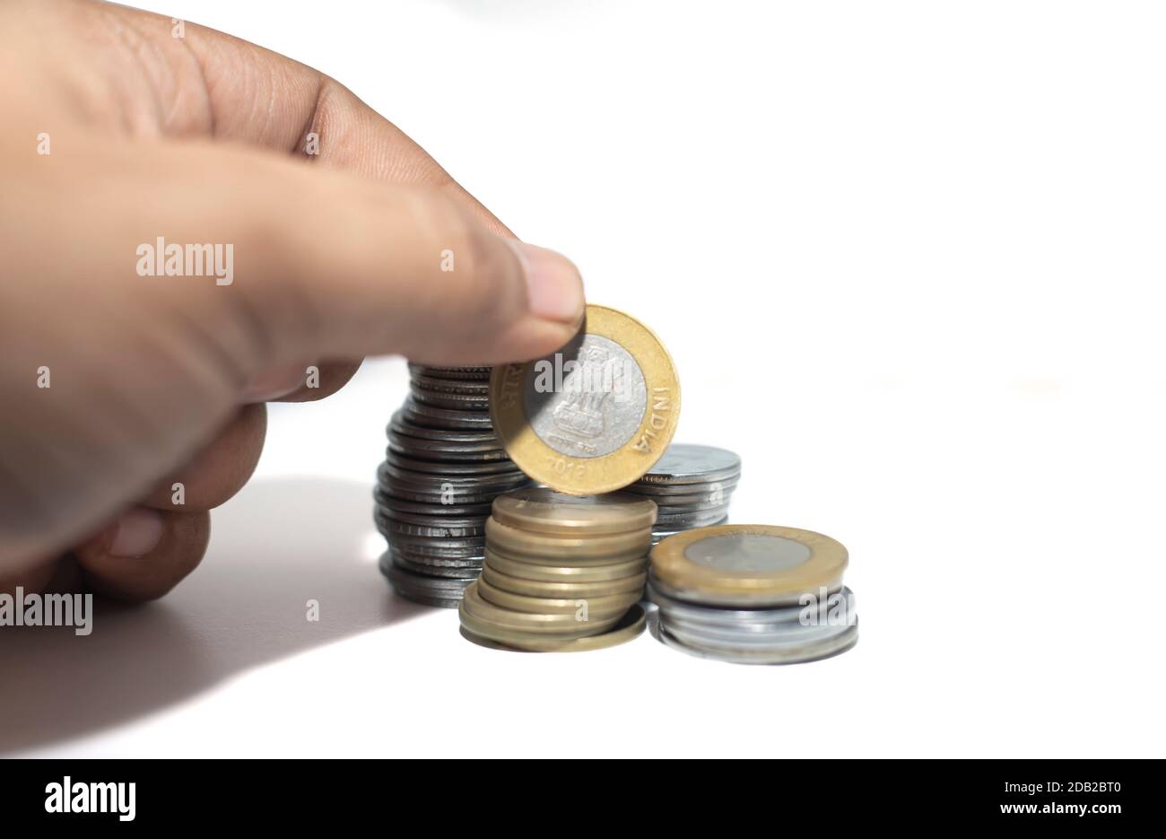 Hand with Indian currency coins isolated on white backgrounds Stock ...