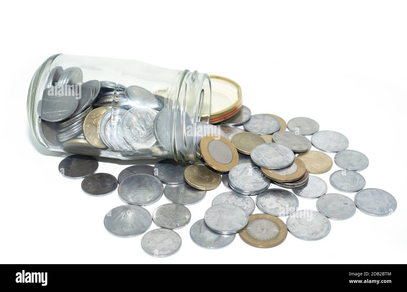 Coins pouring out of glass jar isolated on white background Stock Photo ...