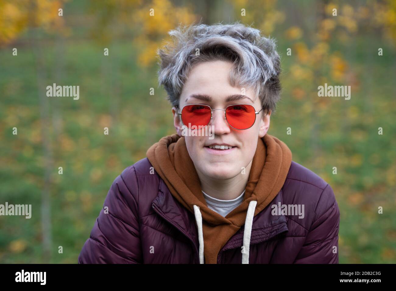 New femininity - gender neutral style. Young woman with stylish short ...