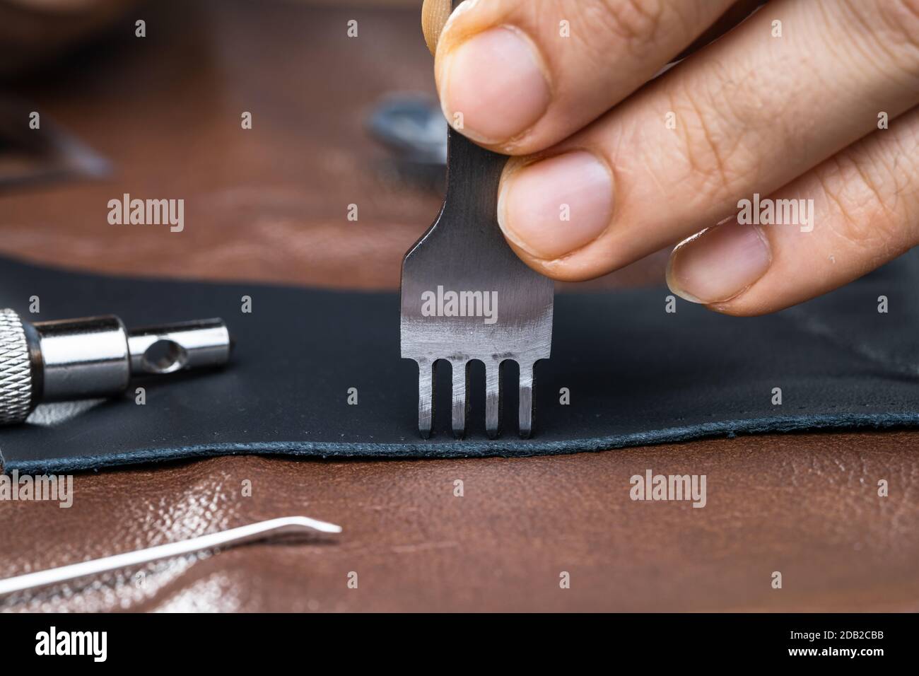 Cobbler Working With Leather. Leather Craft Tools Stock Photo - Alamy