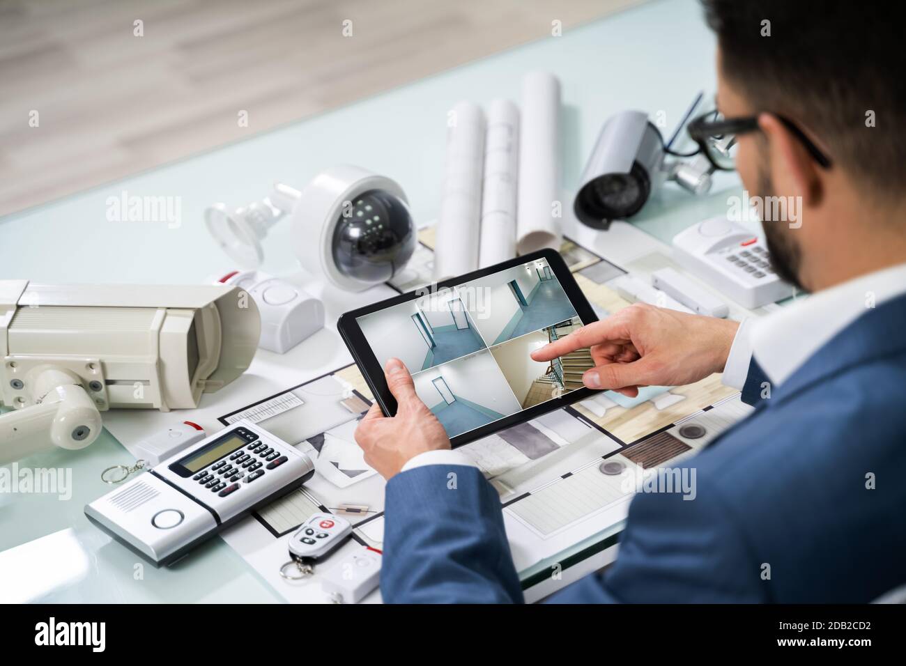 Person Monitoring Smart House On Digital Tablet Stock Photo - Alamy