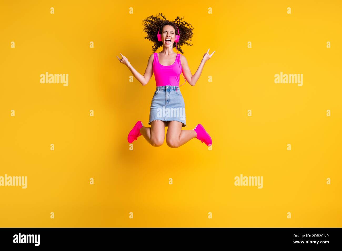 Full size photo of crazy funny rocker lady jump high listen earphones ...