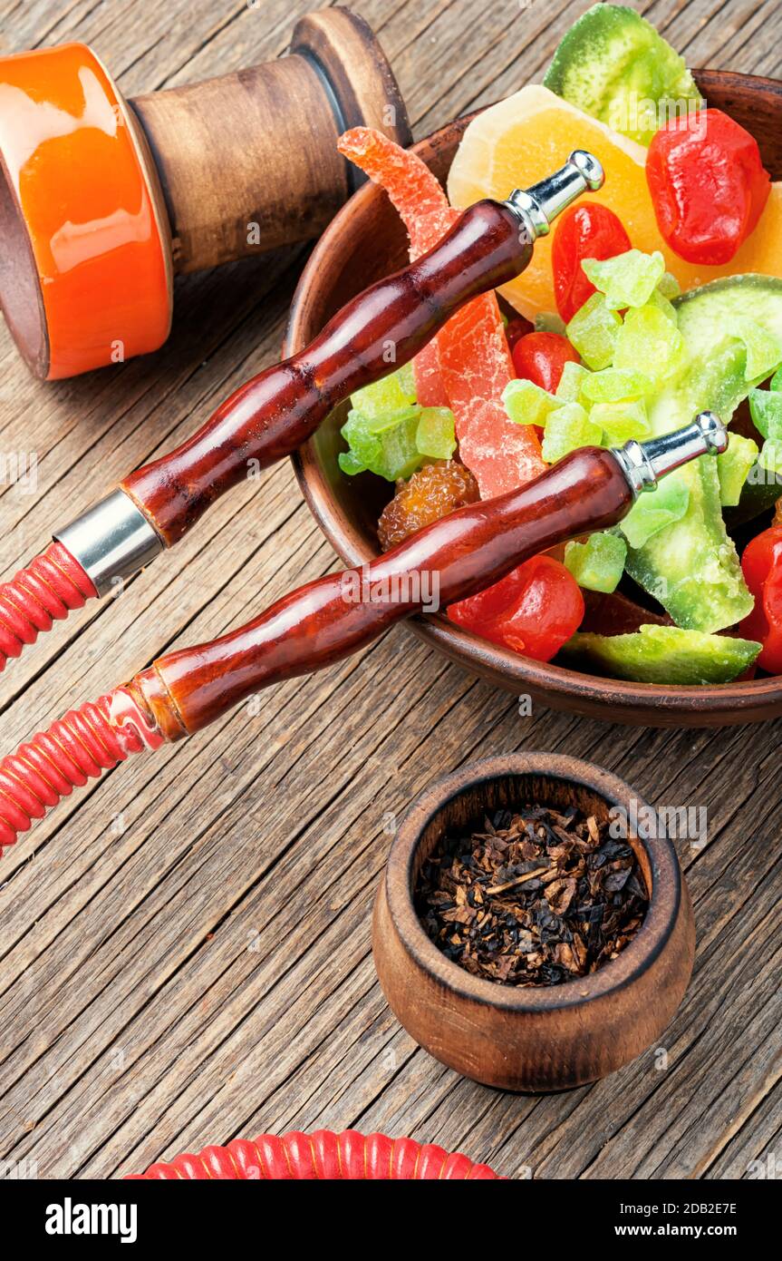 Details of oriental hookah and shisha tobacco with candied fruit ...