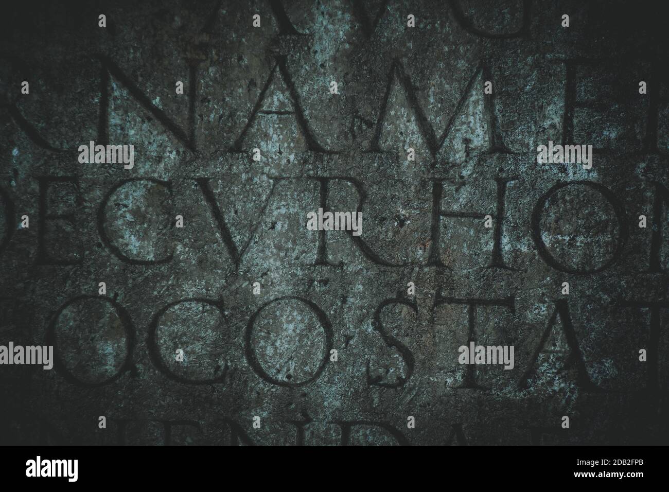 An ancient Roman text carved in stone, background or book cover Stock ...