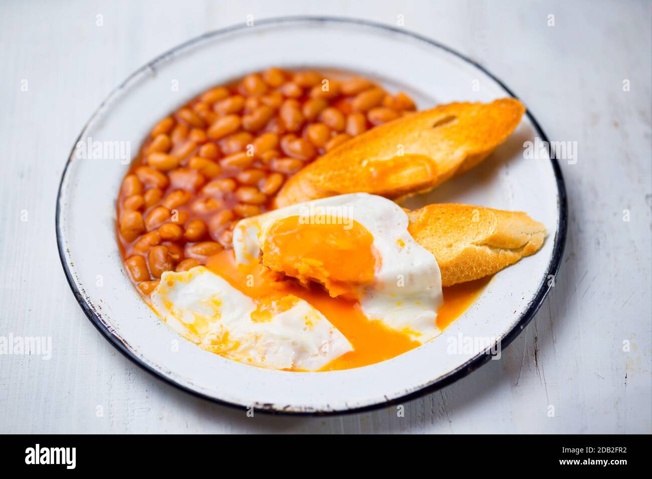 closed up of rustic english baked beans egg toast breakfast Stock Photo ...