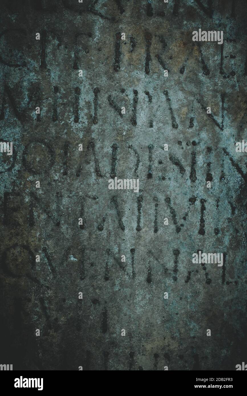 An ancient Roman text carved in stone, background or book cover Stock ...