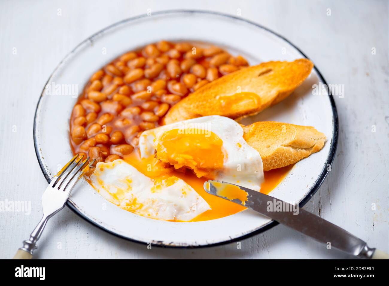 closed up of rustic english baked beans egg toast breakfast Stock Photo ...