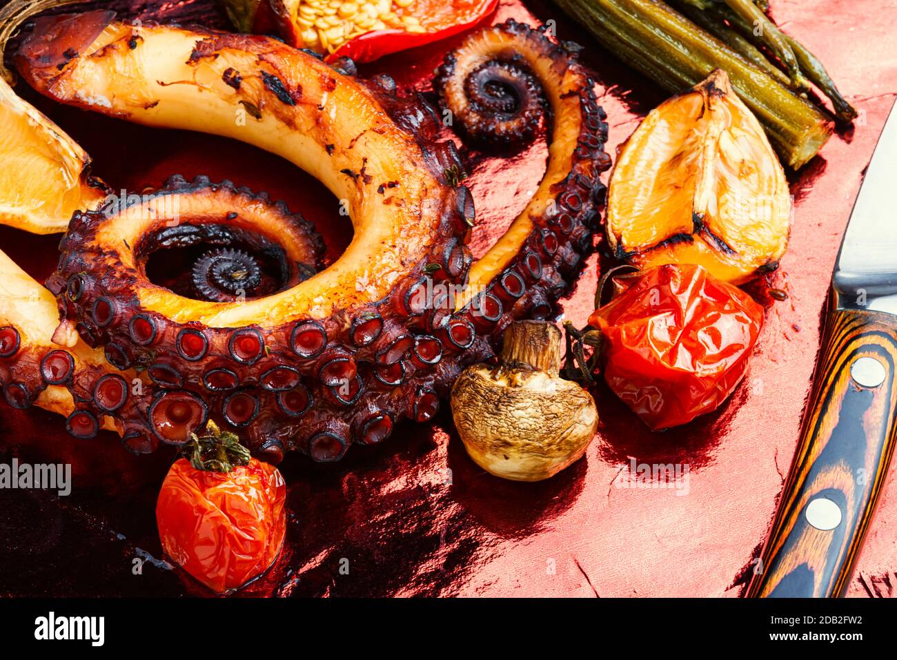 Roasted octopus with bbq vegetables.Octopus tentacles on grill Stock ...