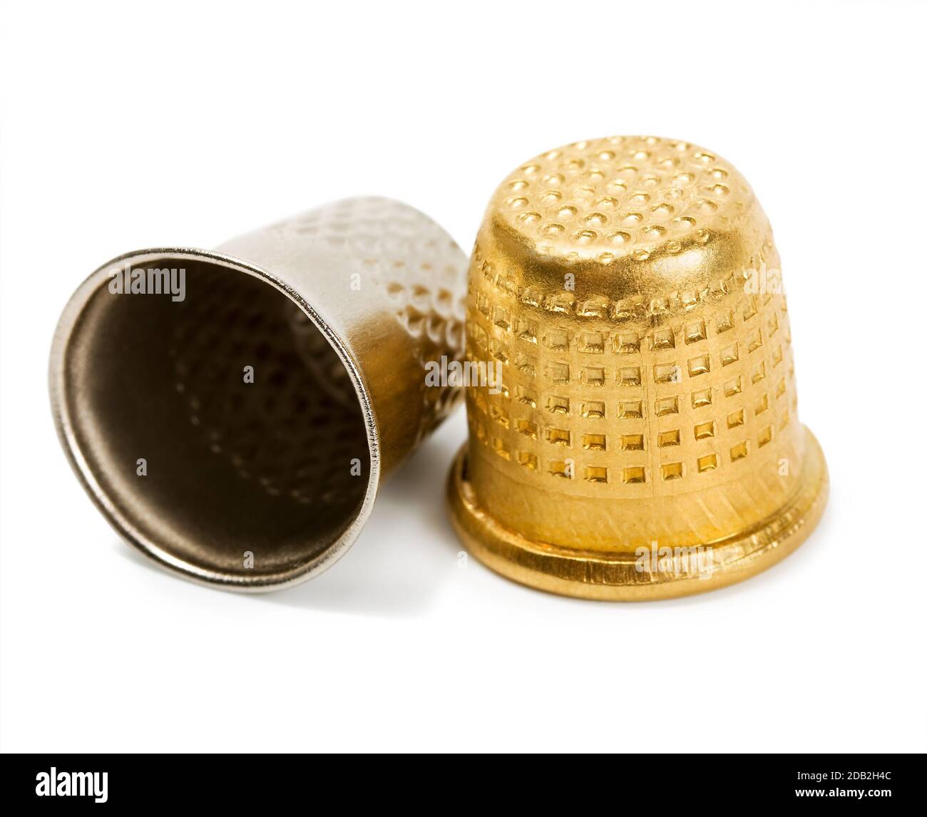 Thimble gold and silver isolated on white background Stock Photo - Alamy