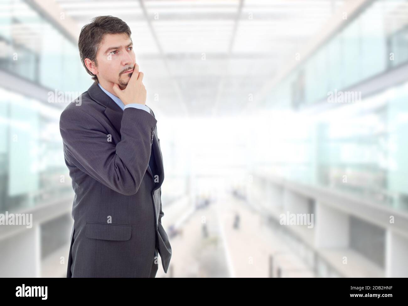 young business man thinking, at the office Stock Photo - Alamy