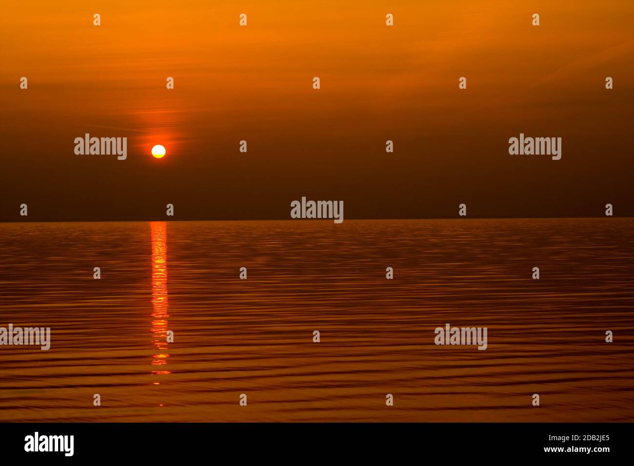 sundown scene with dark clouds and rays over sea. background, wallpaper ...