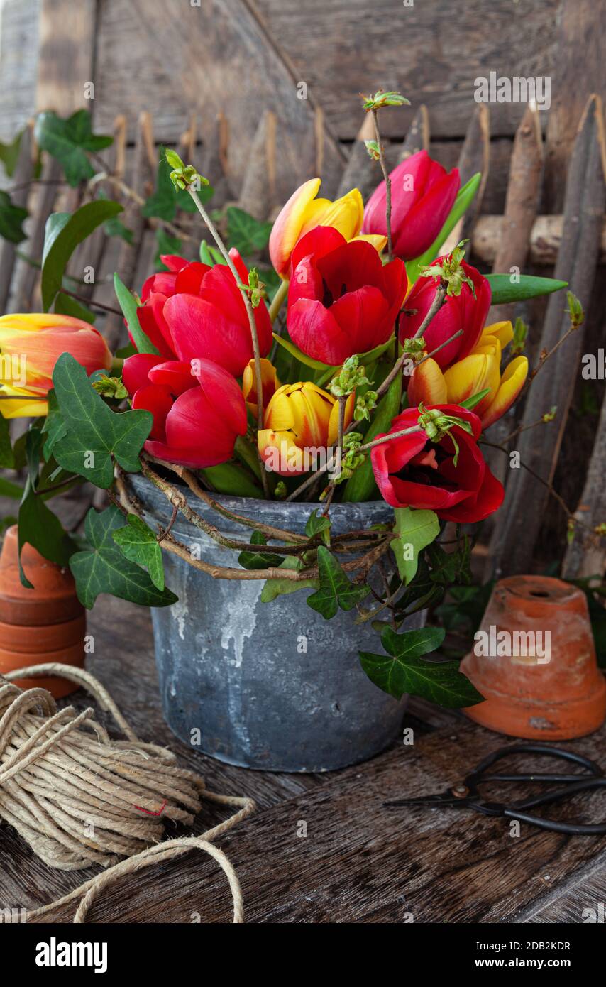 Colorful bunch of flowers with fresh tulips and ivy Stock Photo - Alamy
