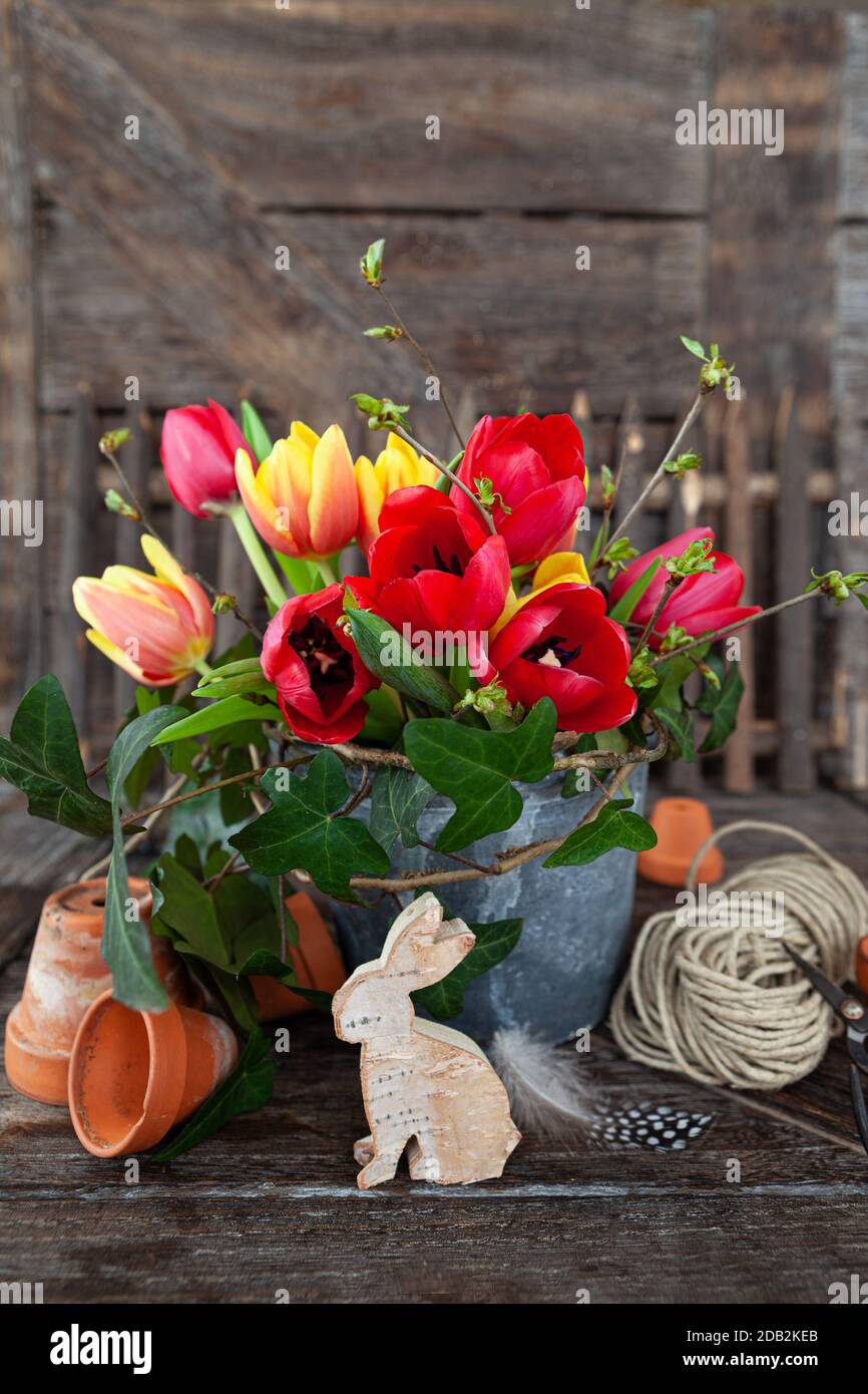 Colorful bunch of flowers with fresh tulips and ivy Stock Photo - Alamy