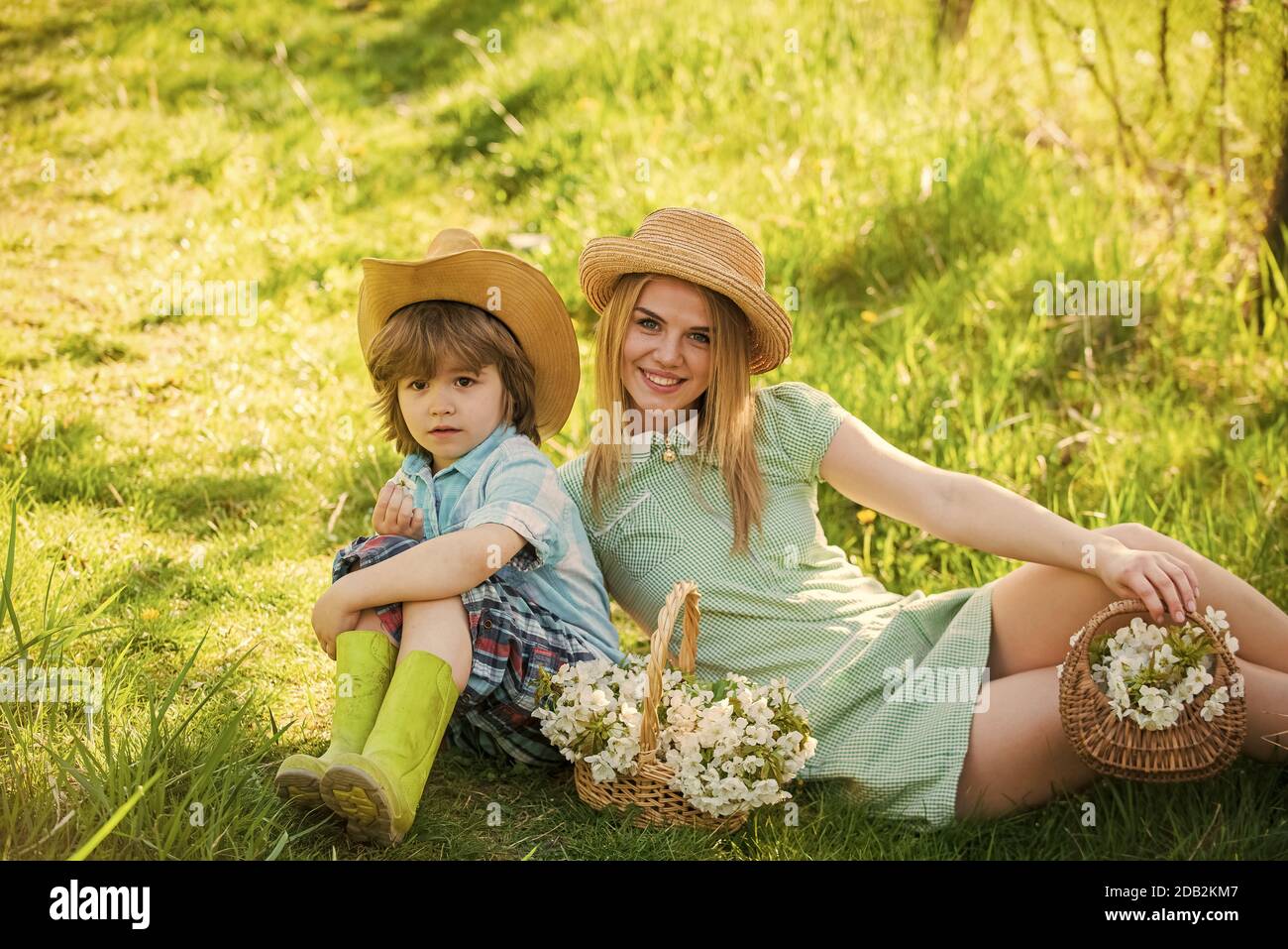 Spring mood. Portrait mom and little son outdoor. cheerful child with ...