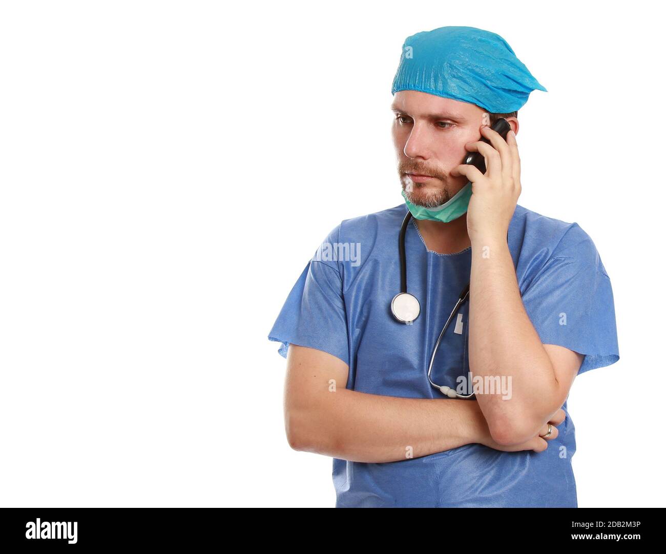 A concerned doctor speaking on the phone isolated on a white background ...