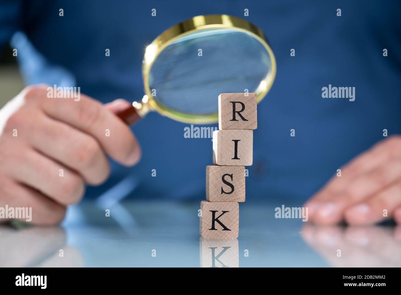 Inspecting Risk Blocks With Loupe Over Black Background Stock Photo - Alamy