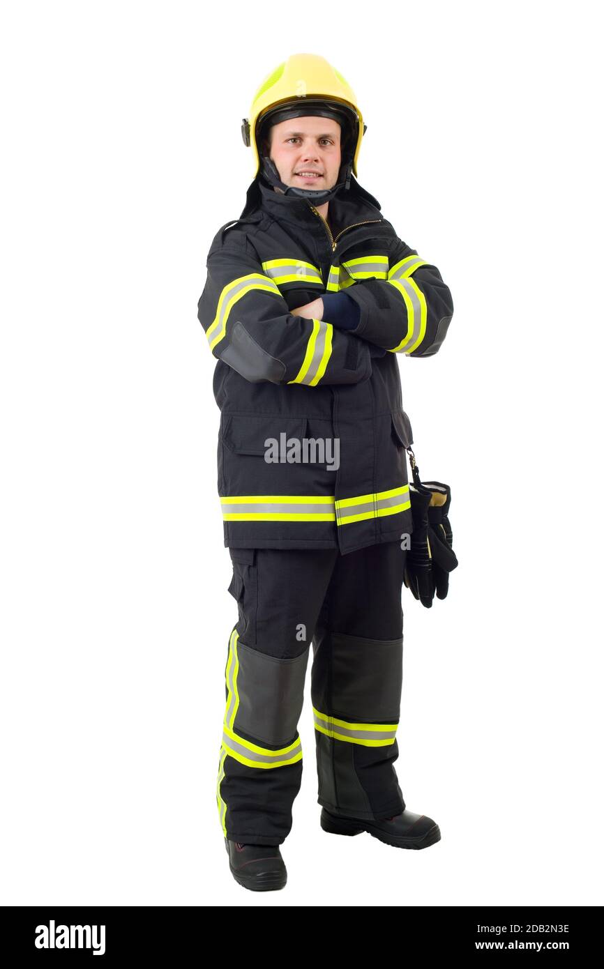 Serious firefighter posing with arms crossed. Full length studio shot ...