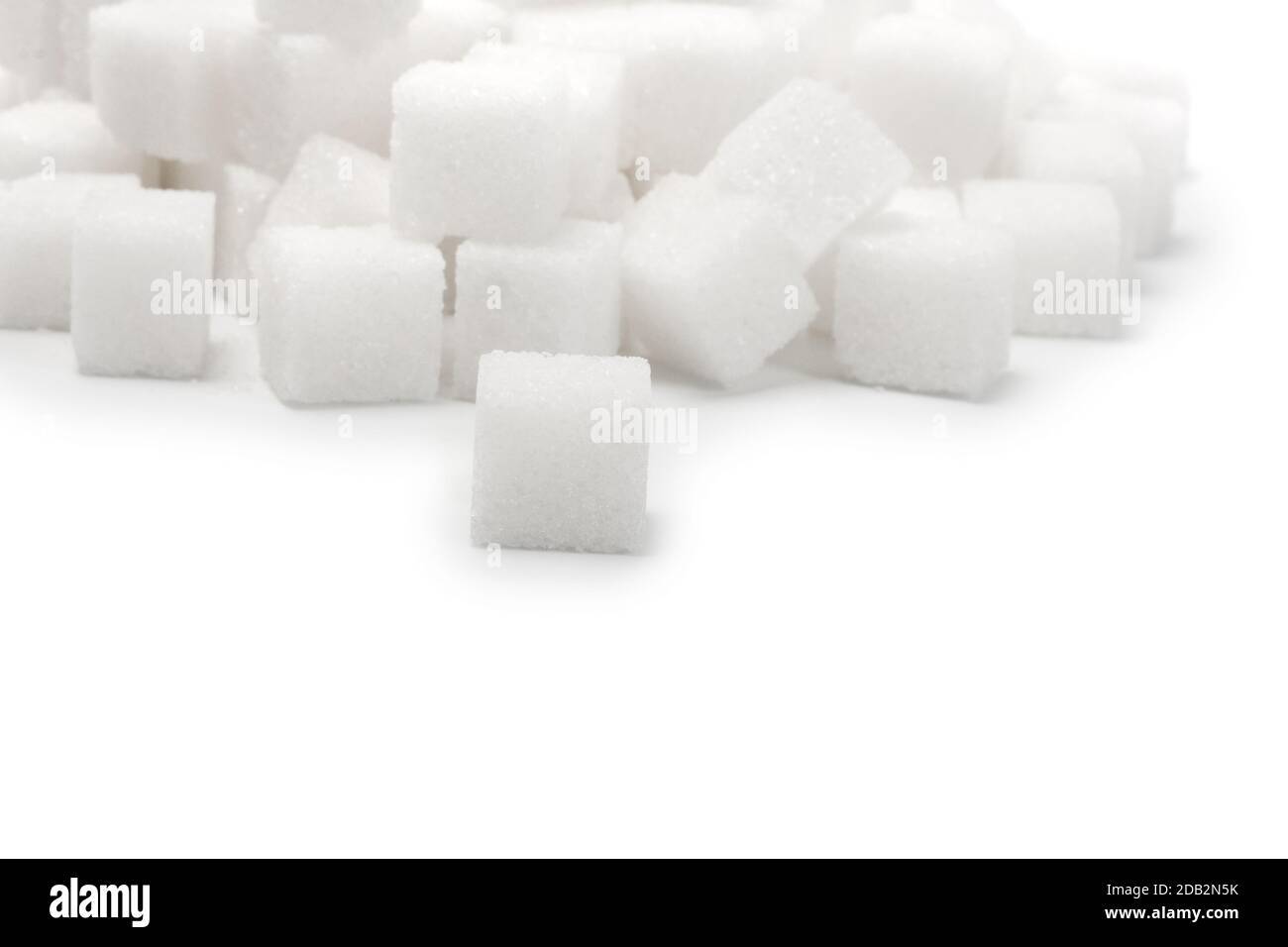lump sugar pile isolated on white background Stock Photo - Alamy