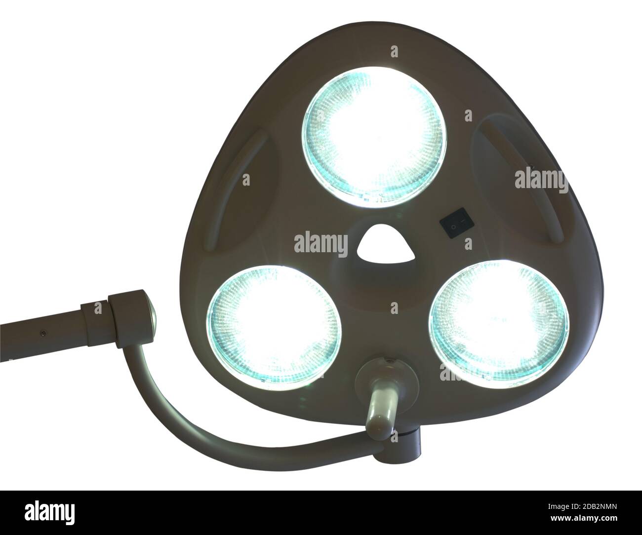 A low angle shot of a big surgical lamp isolated on white background ...